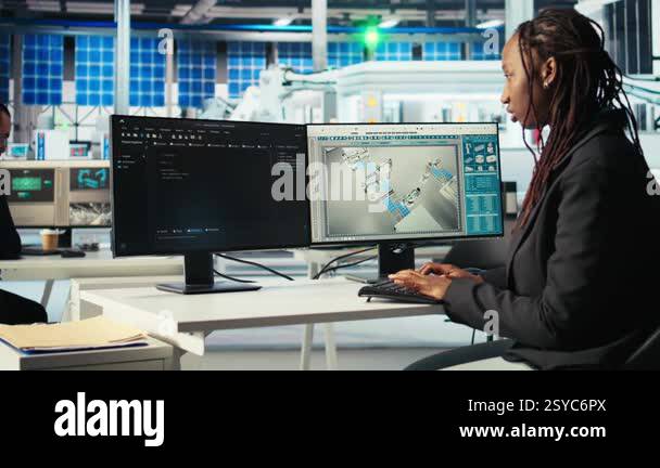 Photovoltaics factory programmer coding app monitoring system performance. Solar panels ...