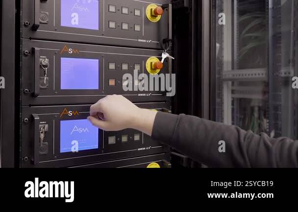 Employee Presses a Touchscreen on an Industrial Control Device with a ...