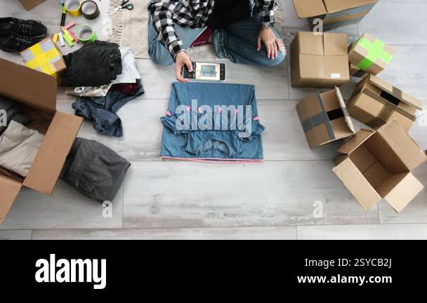 Girl Takes Photos Of Used Clothes And Dress For Selling At Pre-Owned ...