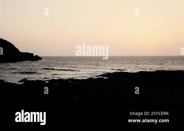 Time-lapse clip of magnificent ocean dark beach and cinematic sea ...