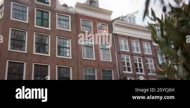 A breathtaking view of charming traditional Amsterdam buildings that ...