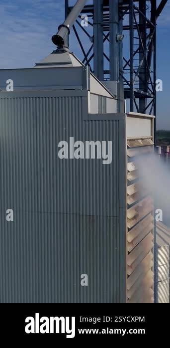 Smoke from industrial plant. Modern grain elevators from the air ...
