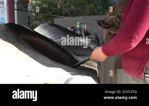 Traditional Turkish bread baking in a tandoor (clay oven). Ramadan ...