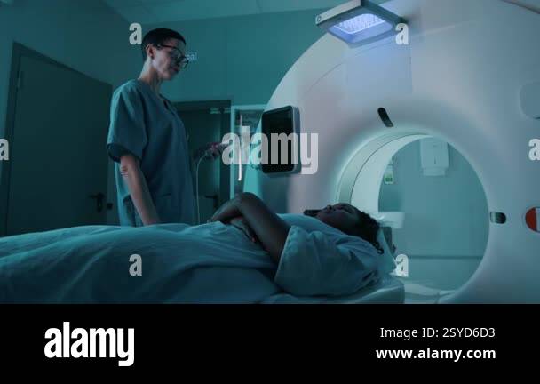 Medium shot of middle-aged Caucasian female radiologist pressing ...