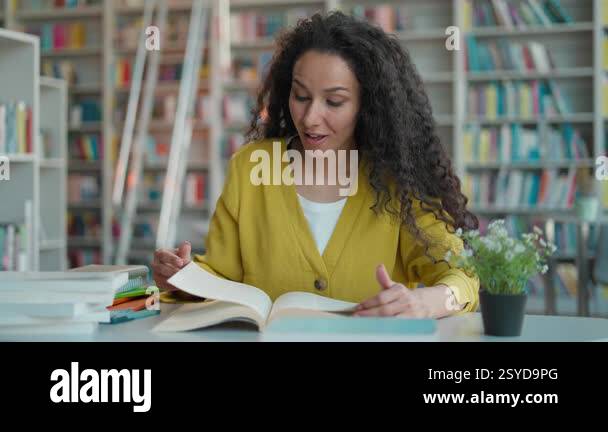 Latina Caucasian Hispanic woman reading favorite book novel interested ...