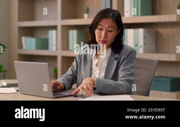 Asian business woman phone call talking in office Chinese Korean ...