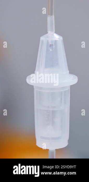 Liquid medicines slowly dripping inside the reservoir of drop counter ...