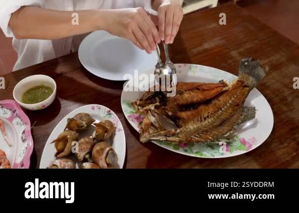 Two people eating fish Stock Videos & Footage - HD and 4K Video Clips ...