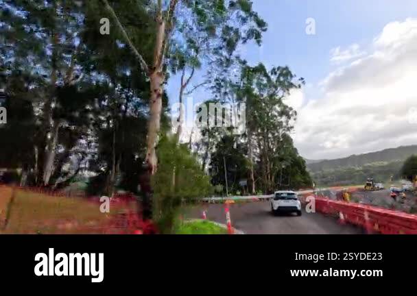 Scenic drive through lush greenery and construction Stock Video Footage ...