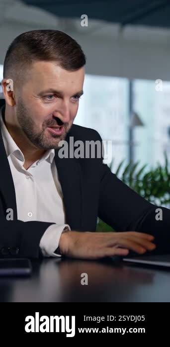 Successful businessman working in modern office. Happy confident smart ...