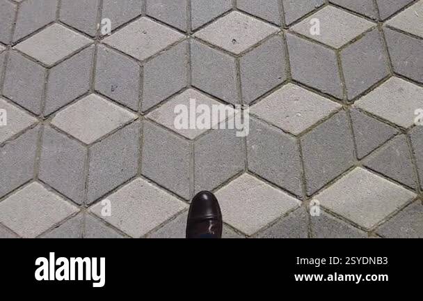 A man walks along beautiful paving stones and dreams of good things. A ...