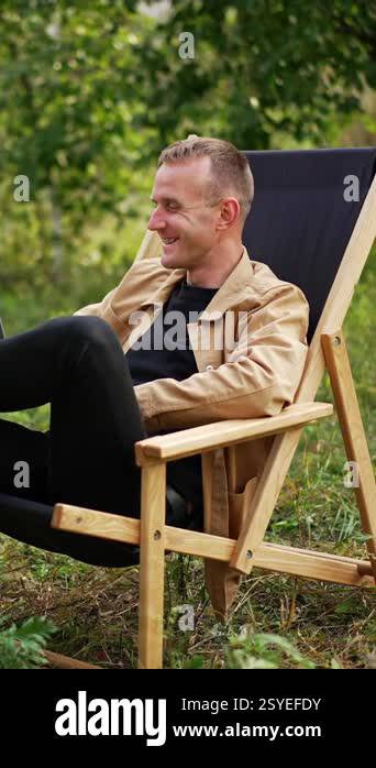 Computer working man in green nature garden. Professional manager with ...