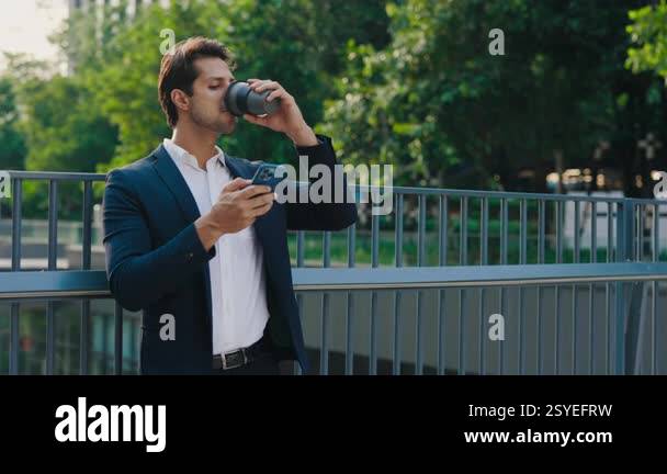 Handsome Smiling Office Man Texting Using Phone and Drinking Coffee ...