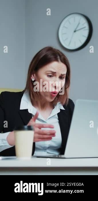 Vertical Format Video of Stressed businesswoman annoyed using stuck ...