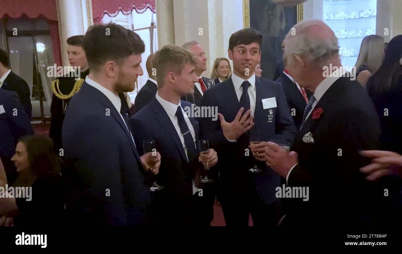 King makes a splash with Olympic stars at palace reception Stock Video ...