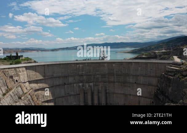 Water reservoir and a dam in Dagestan Aerial view of the concrete dam ...
