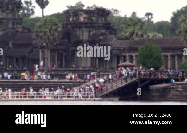 Blurred defocused view of crowd of local people in the entrance of ...