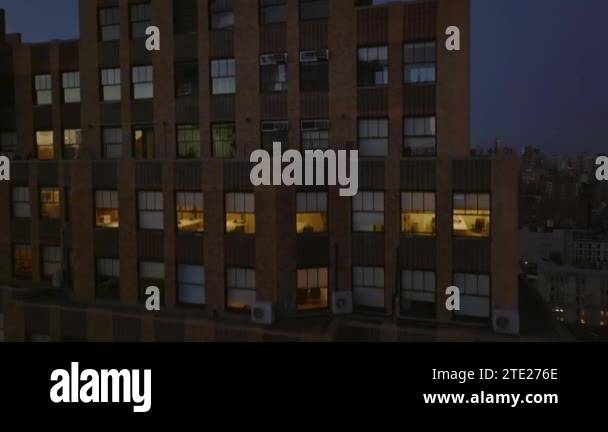 Ascending footage along wall of high rise office building. Revealing ...