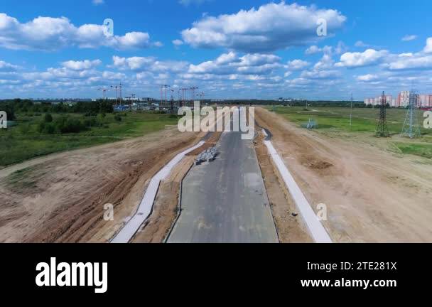 Construction of a bypass avenue in suburbs of metropolis. Laying of ...