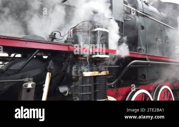 A retro steam locomotive prepares to leave the station Stock Video ...