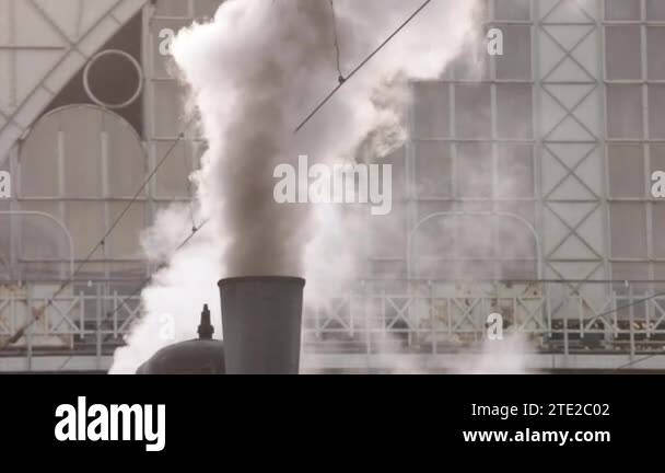 Steam pipe of steam locomotive of railway. Factory pipe of steam ...