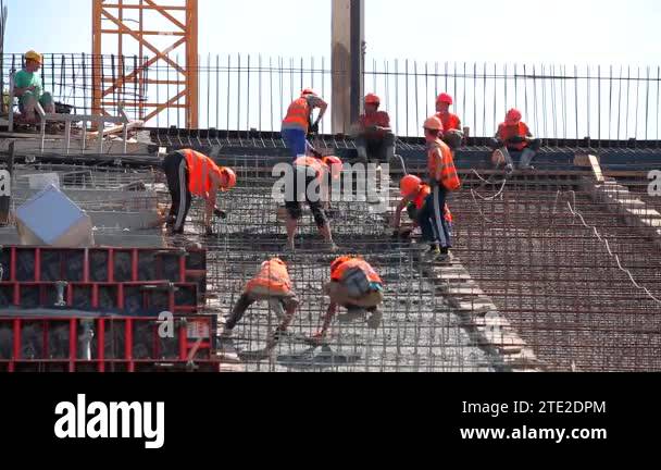 Building construction. Working process at a construction site. Builders ...