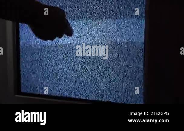 Girl Changes Channels on an Old TV with Noise Stock Video Footage - Alamy
