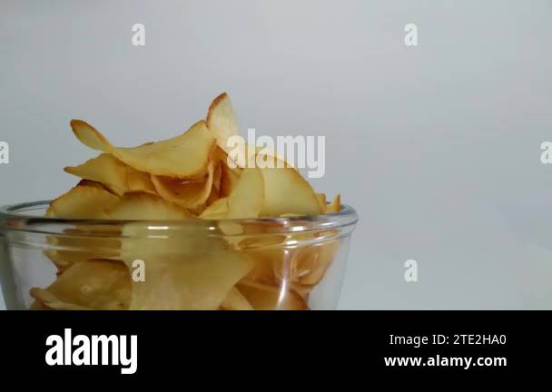 Concept 7-K1 Spinning bowl full of cassava crisp with white background ...