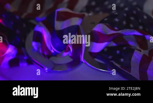 Flashing red and blue police lights of handcuffs police with legal law ...