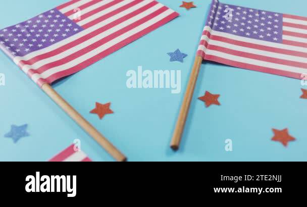 American flags with red and blue stars lying on blue background ...