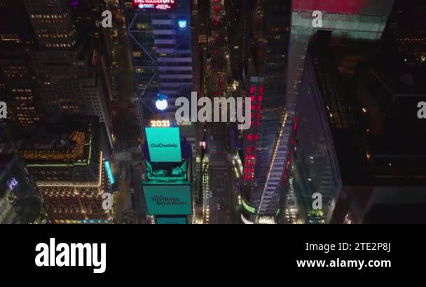 Tilt down shot of buildings around Times Square. Glossy facades ...