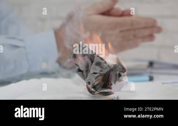 Blurred Shooting with a Disappointed Person Reading and Burning a ...