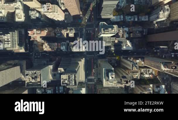 Aerial birds eye overhead top down panning footage of regular streets ...