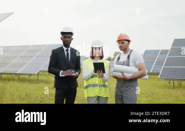 Green energy production and cooperation concept. Multi ethnic people in ...