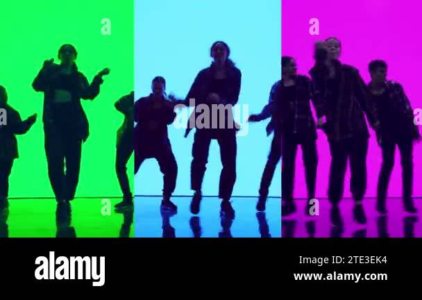 Montage of Dancers Performing in Front of Animated Digital Screen Stock ...
