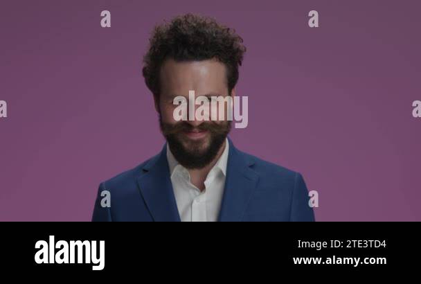 happy man on purple background smiling, laughing, holding arms up ...