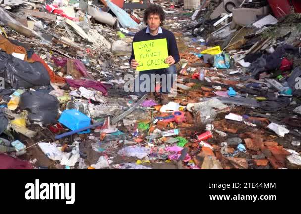 Man 40 years old ecologist holding a sign with the words save the ...
