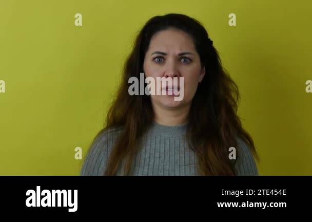Beautiful angry woman frowning while looking at camera in anger on ...