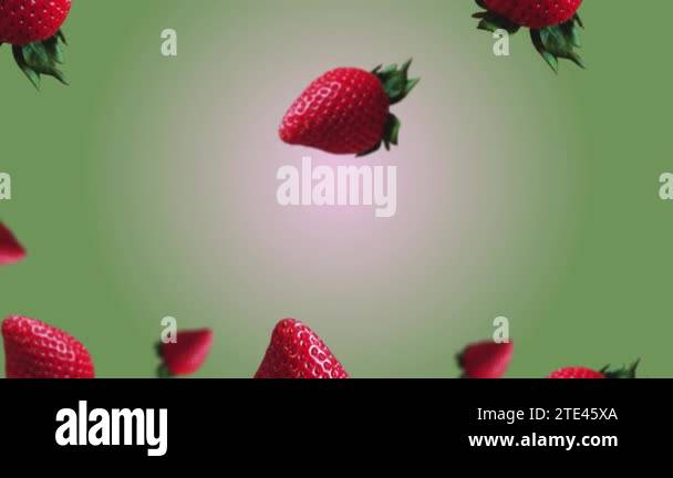 Flying and wiggle of different diameters whole of strawberries with ...