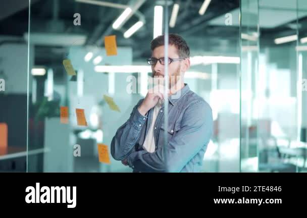 creative young entrepreneur business man in modern office uses post ...