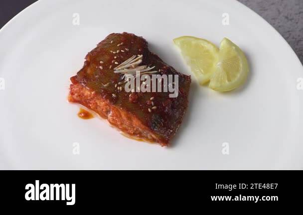 Fish boiled in spiced gochujang sauce. Braised plaice using spicy sauce ...