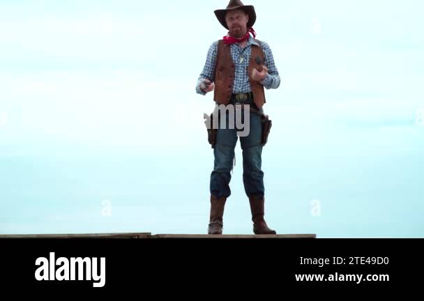 Funny cowboy shoot with vintage pistol revolver. American gunslinger on ...