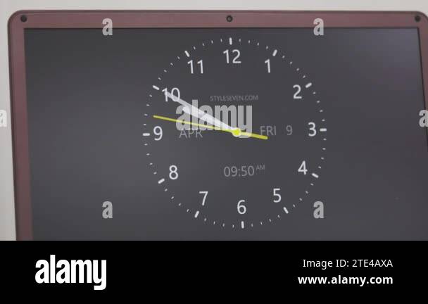 Analog clock on laptop screen. Clock with arrow on the laptop screen ...