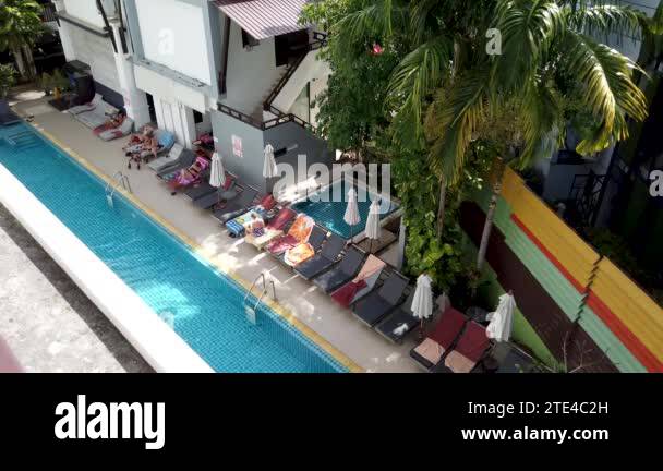 Footage taken of a hotel swimming pool taken from above from a hotel ...