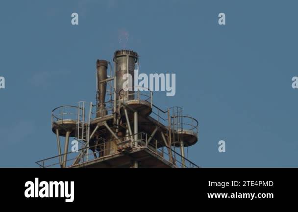 Burning off excess gas at Oil refinery petrochemical plant factory from ...