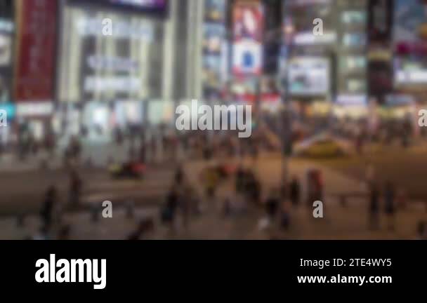 Blurred defocused Timelaps walking crowd people crossing street Taipei City. Pedestrians walk ...