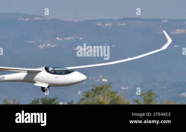 Glider takes off towed with a rope. Gliders fly silently using thermal ...