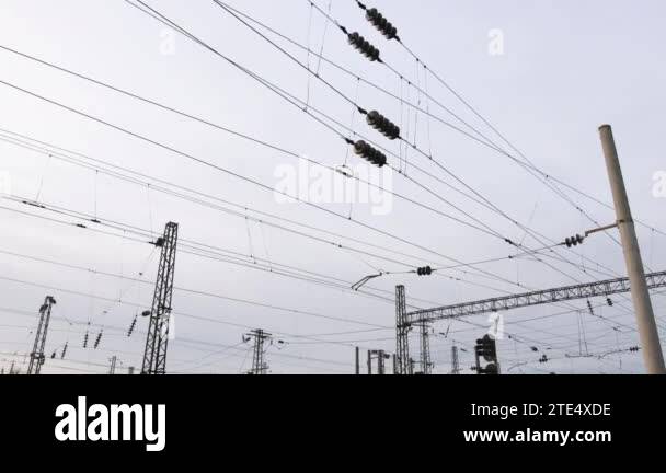 Electric wires on the railway. Transmission lines. View below. railway ...