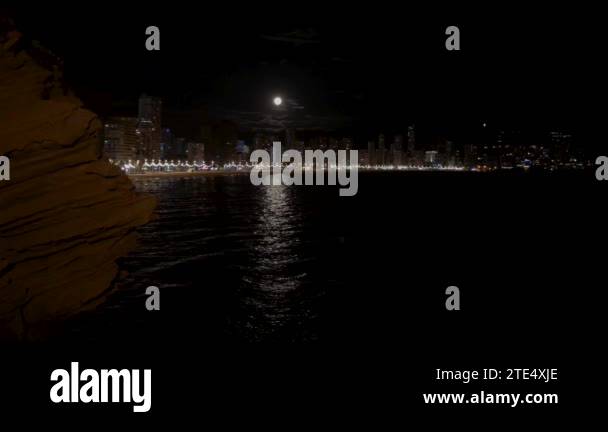 Night footage of the full moon over the Spanish town of Benidorm ...