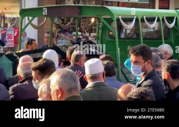 Istanbul, Turkey - November 2021: Crowds of people putting a coffin ...